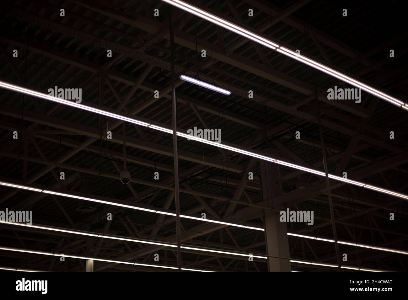 Warehouse ceiling. Lamps on the ceiling. Large room. Details of ...