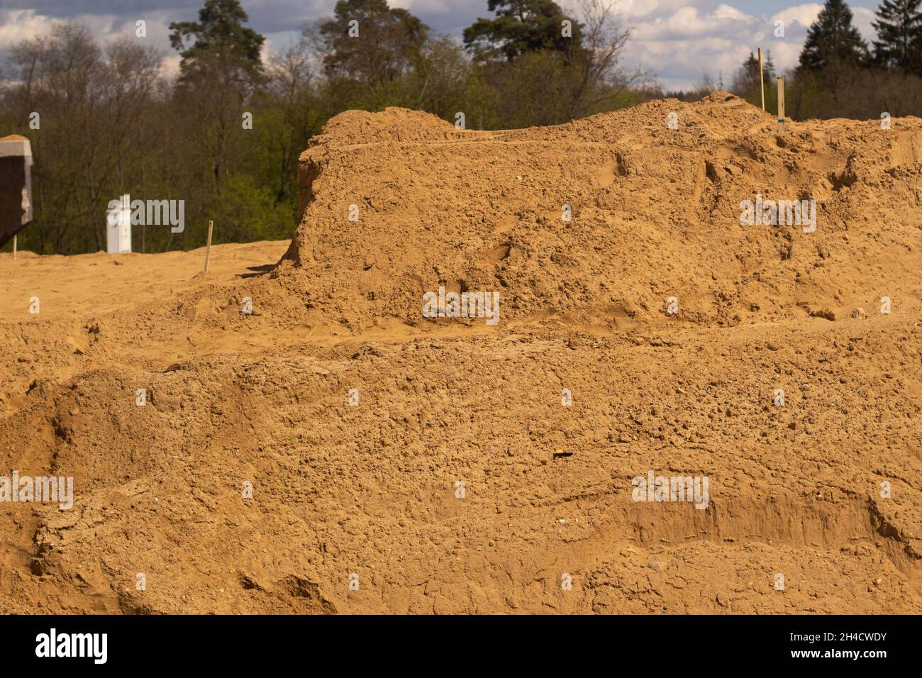Sand platform. Laying sand in the base. A lot of building material ...