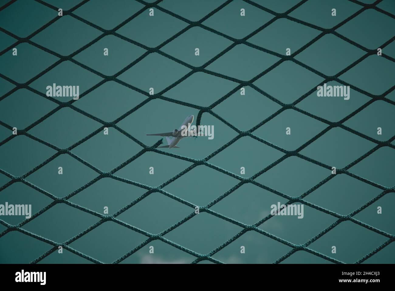 Broken net and plane Stock Photo - Alamy