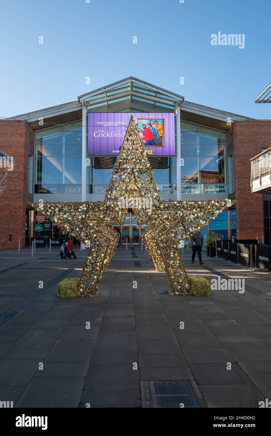 Three giant christmas gold stars outside the front of Chantry Place ...