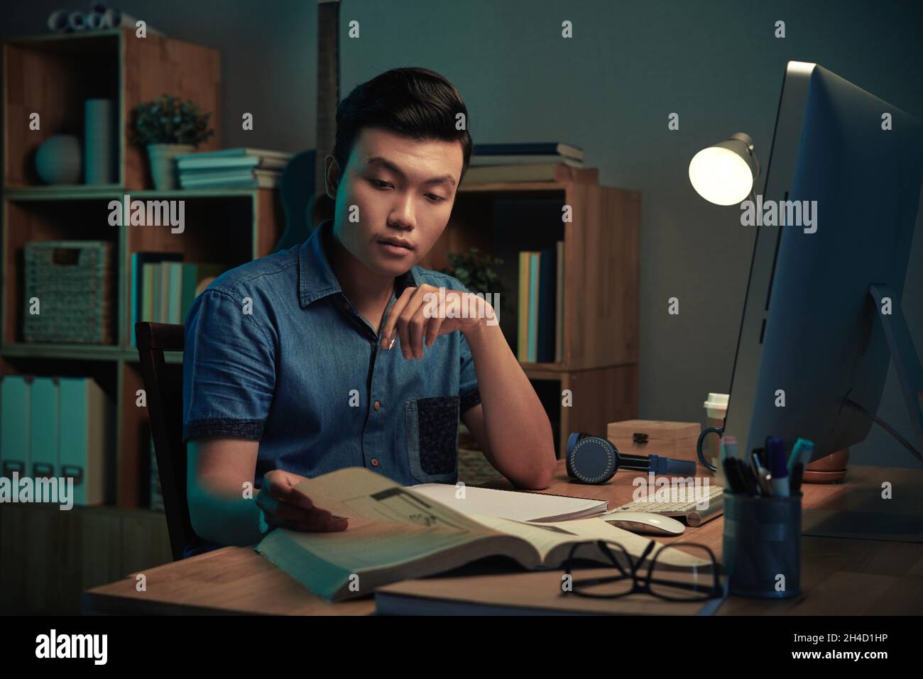 Person reading the computer manual hi-res stock photography and images ...