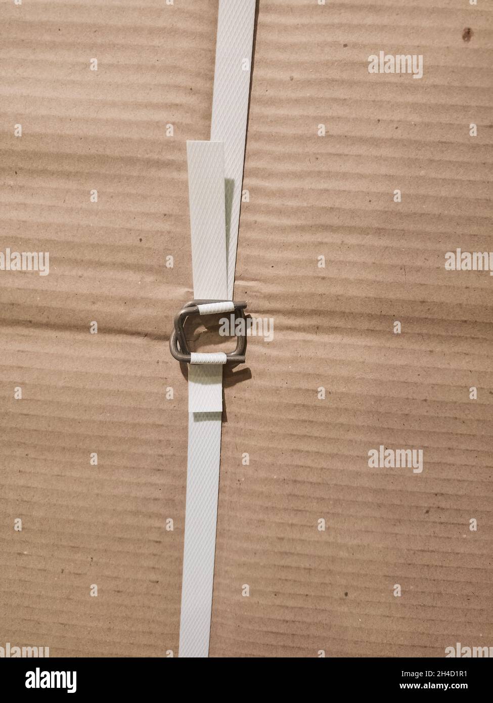 Package. The cardboard is tied with packing tape Stock Photo - Alamy