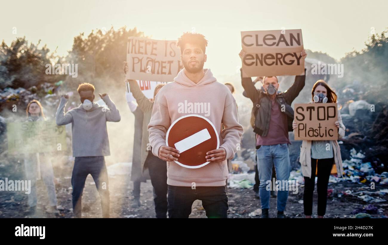 Portrait of Attractive Young Man Activist Holding Stop Sign. In the ...