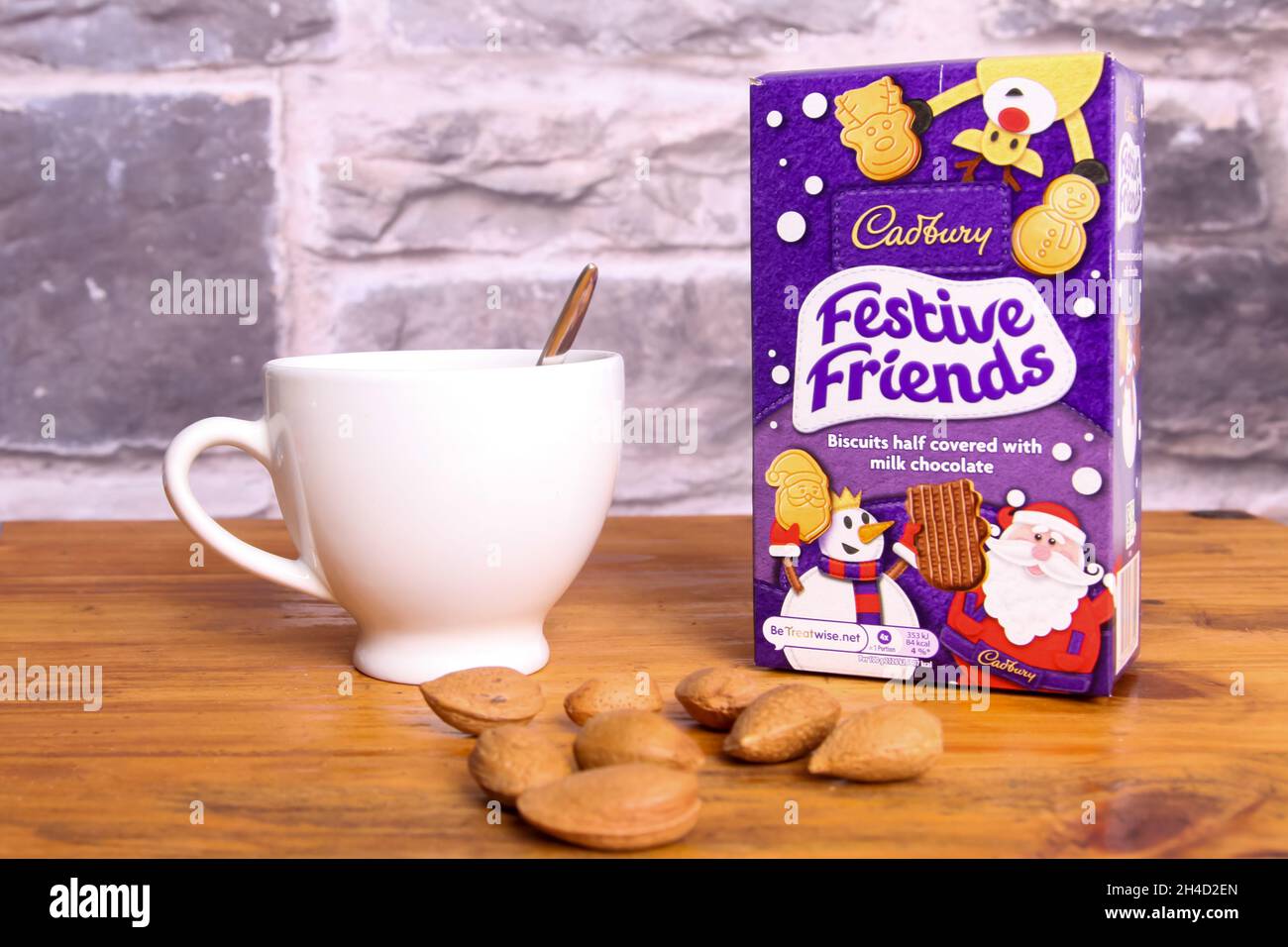 Cadbury Festive Friends chocolate biscuits with a cup of tea on table ...
