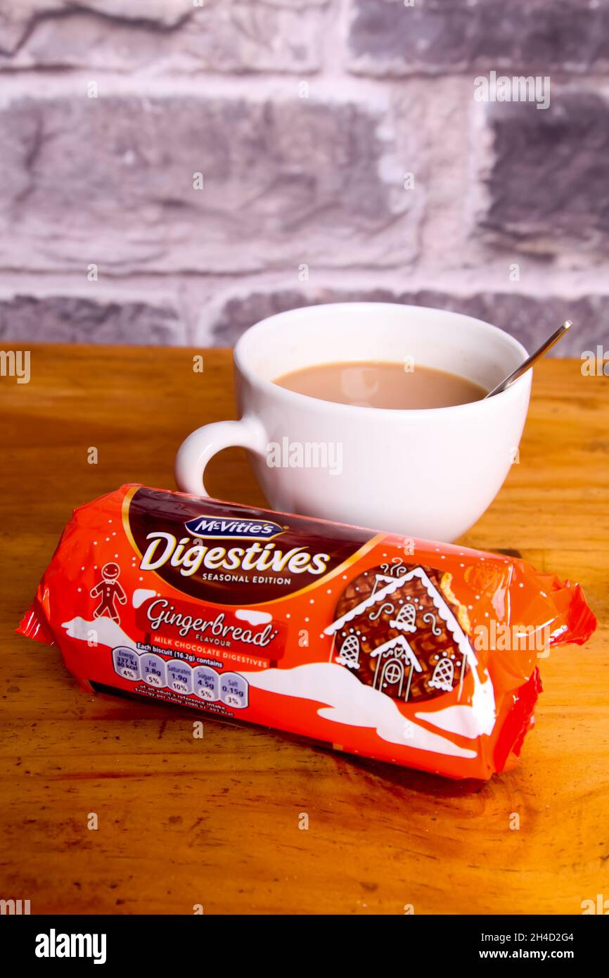 McVities Gingerbread Chocolate Digestives with cup of tea, a sealed ...
