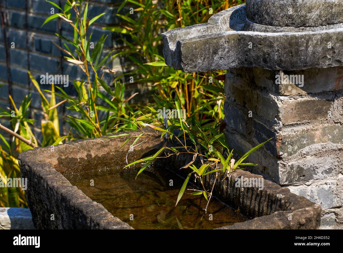Stone mill running water pool in Chinese classical garden Stock Photo ...
