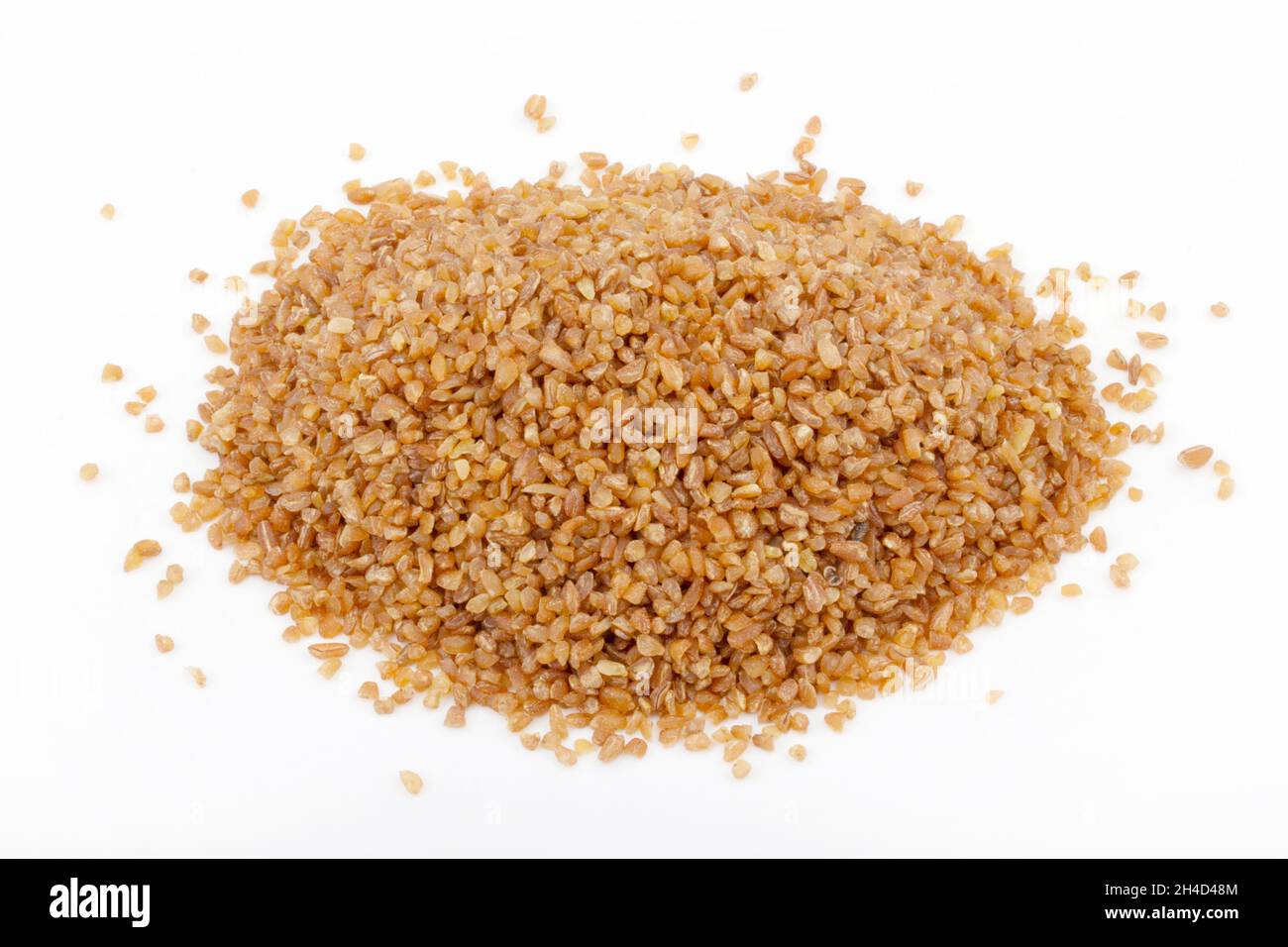 brown bulgur on a white background Stock Photo - Alamy