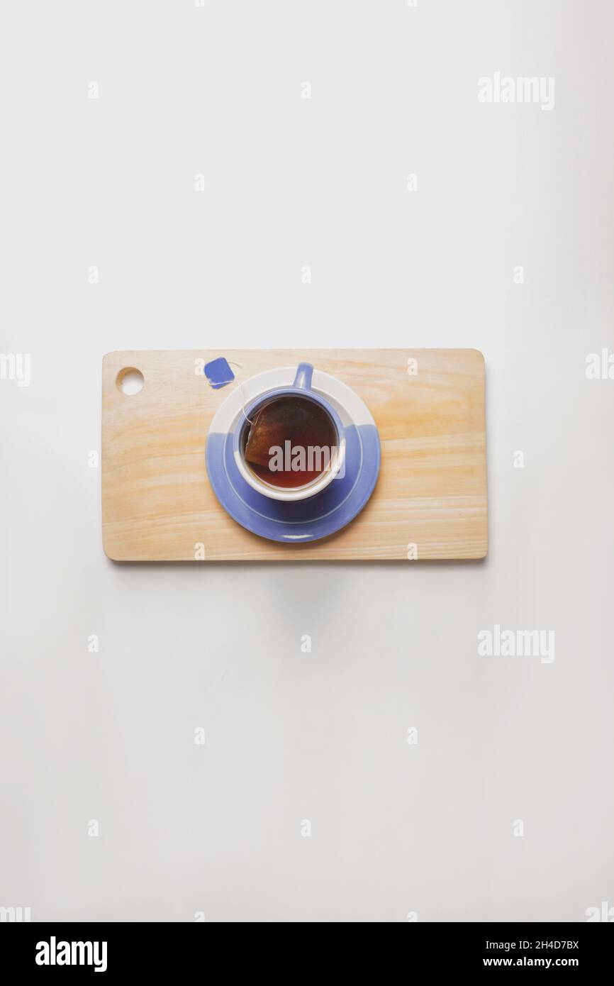 Flat lay Tea on wood on white background vertical Stock Photo - Alamy