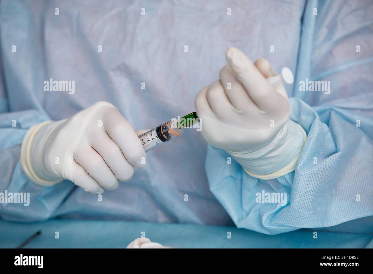 Medical doctor with syringe , focus on her hand Stock Photo - Alamy