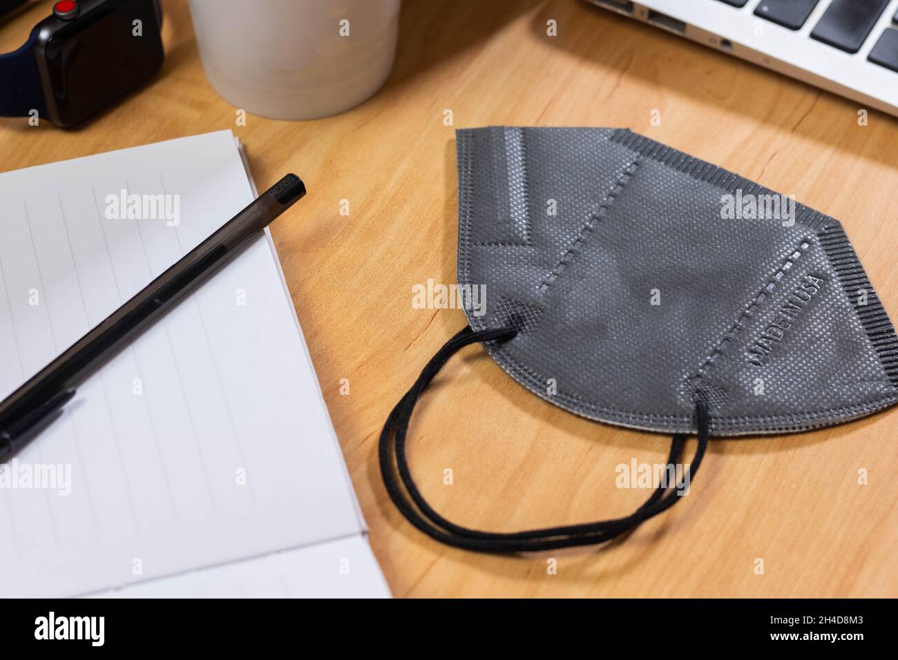 close up to face masks on bright desk. Protection against coronavirus ...
