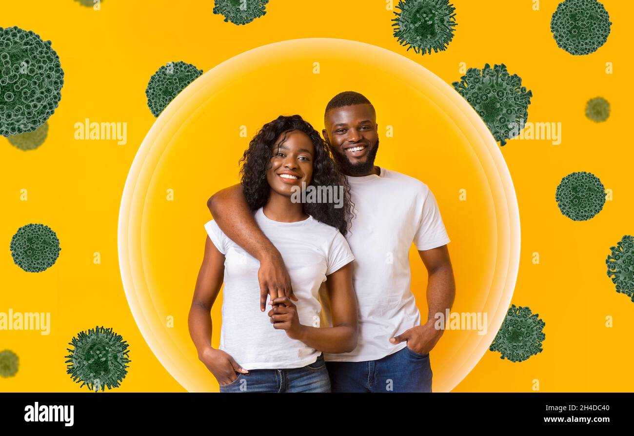 Happy african american man and woman standing inside bubble Stock Photo ...