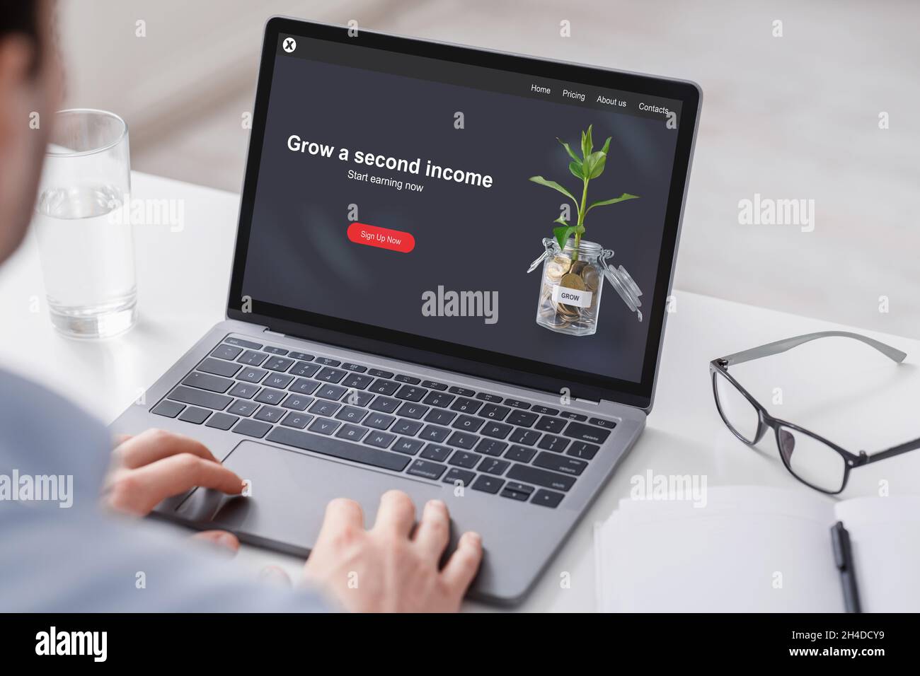 Millennial caucasian man work on computer with grow second income on ...