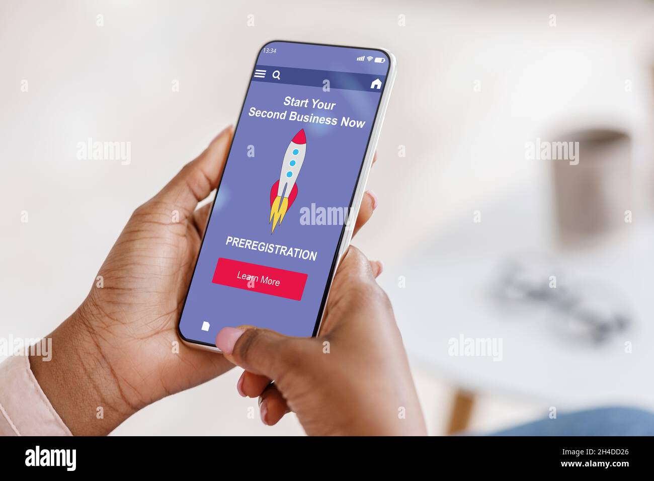 Female hands holds phone with website or app about start second ...