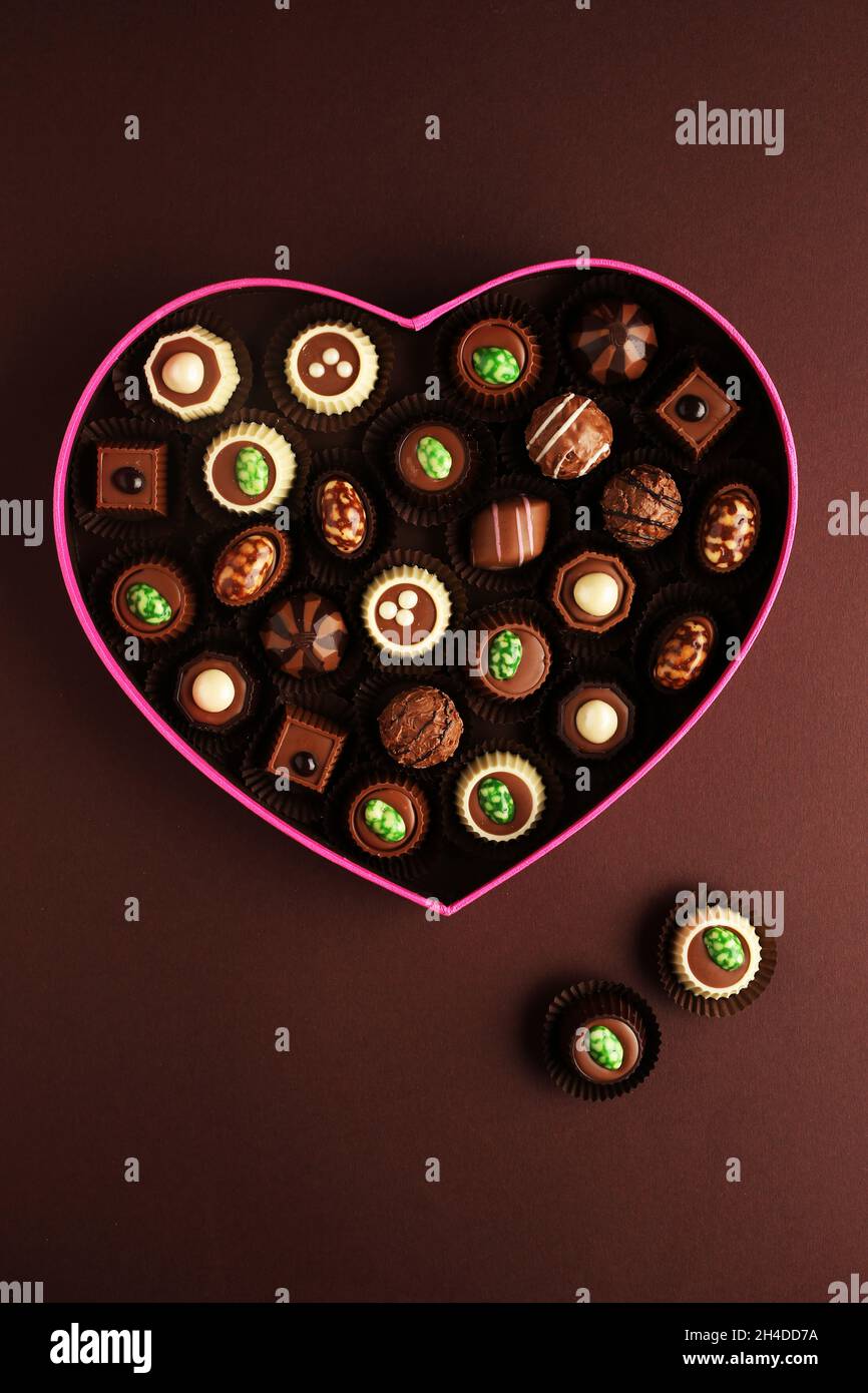 A brown dish that contains the most beautiful and delicious chocolates ...