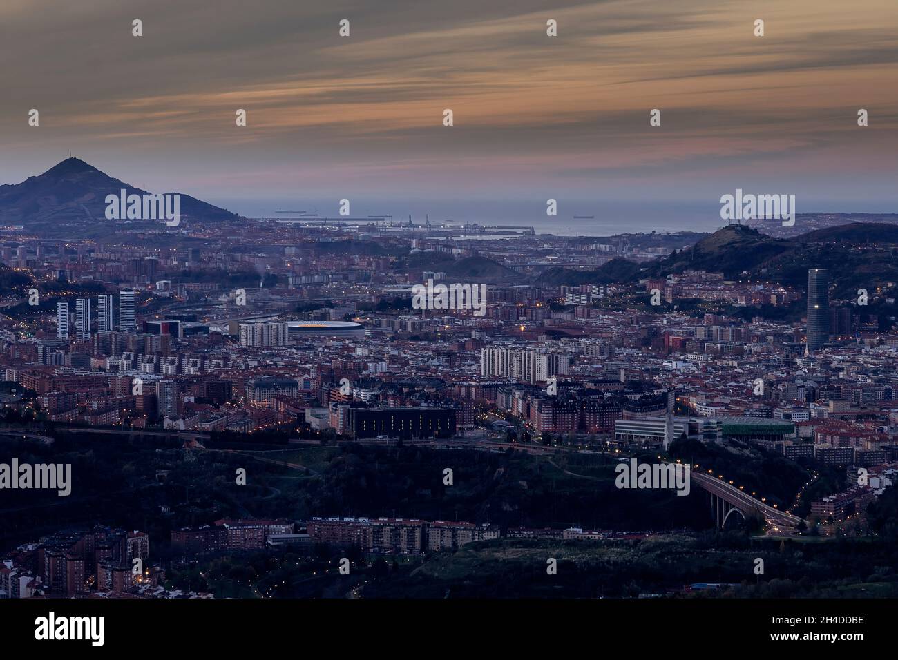view of the city of Bilbao at sunset from a nearby mountain Stock Photo ...