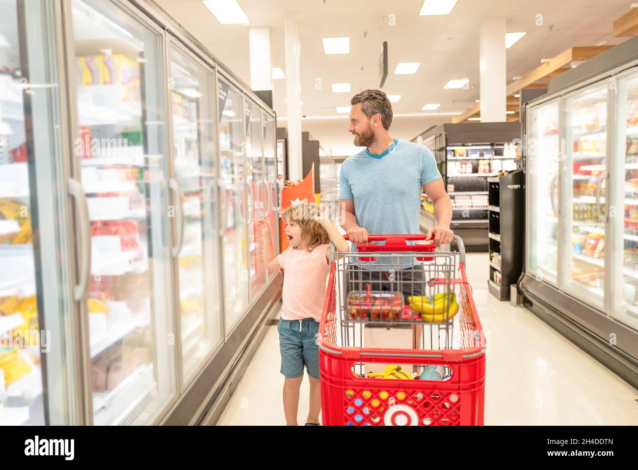 happy family day. father and son with shopping cart. customer consumer ...