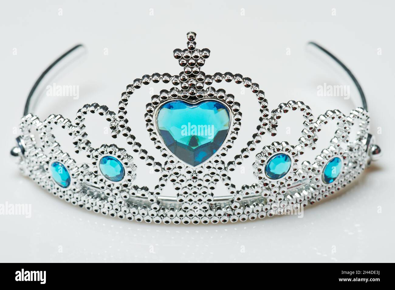 Silver diadem with blue jewerly isolated on white studio background ...