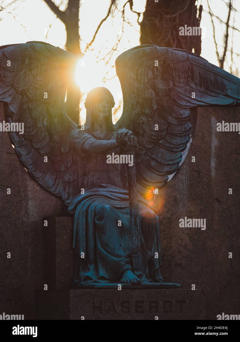 Crying angel headstone under the sunlight in a cemetery in Cleveland ...