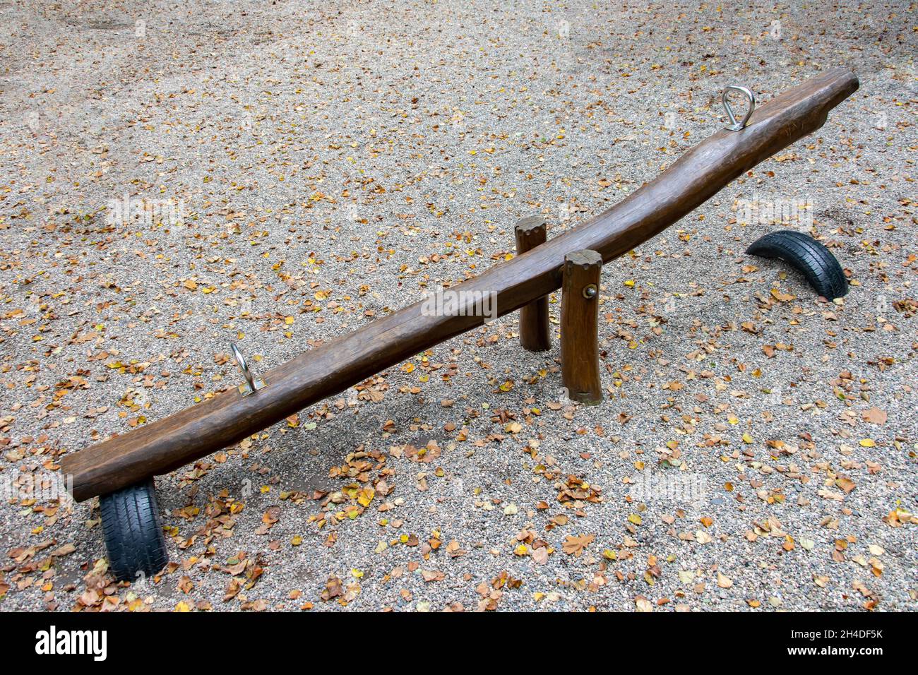 Wooden swing made of logs on the playground Stock Photo - Alamy