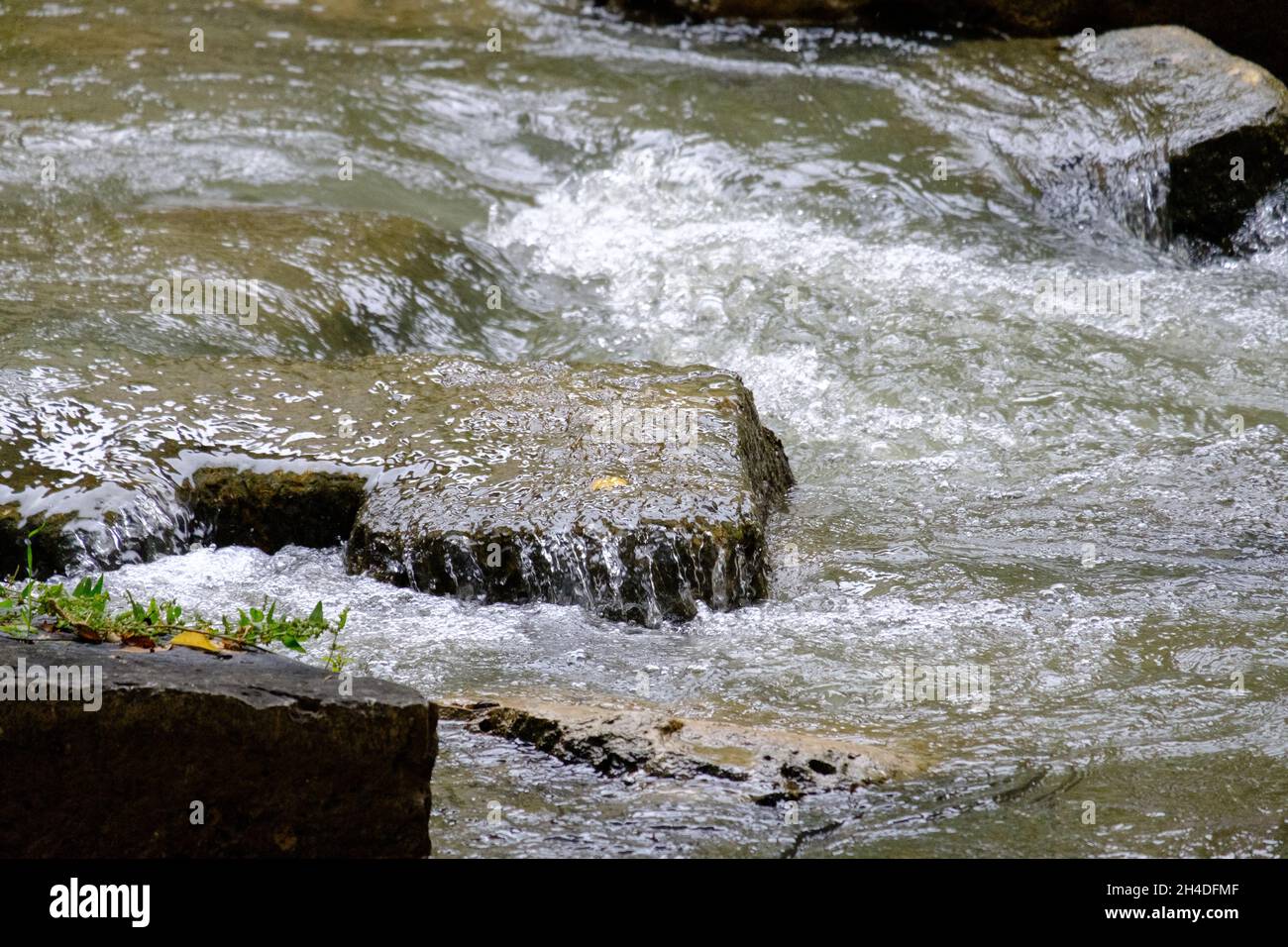water flows between the stones of a building in ruins Stock Photo - Alamy