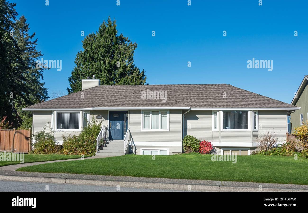 Family house on bright sunny day on blue sky background Stock Photo - Alamy