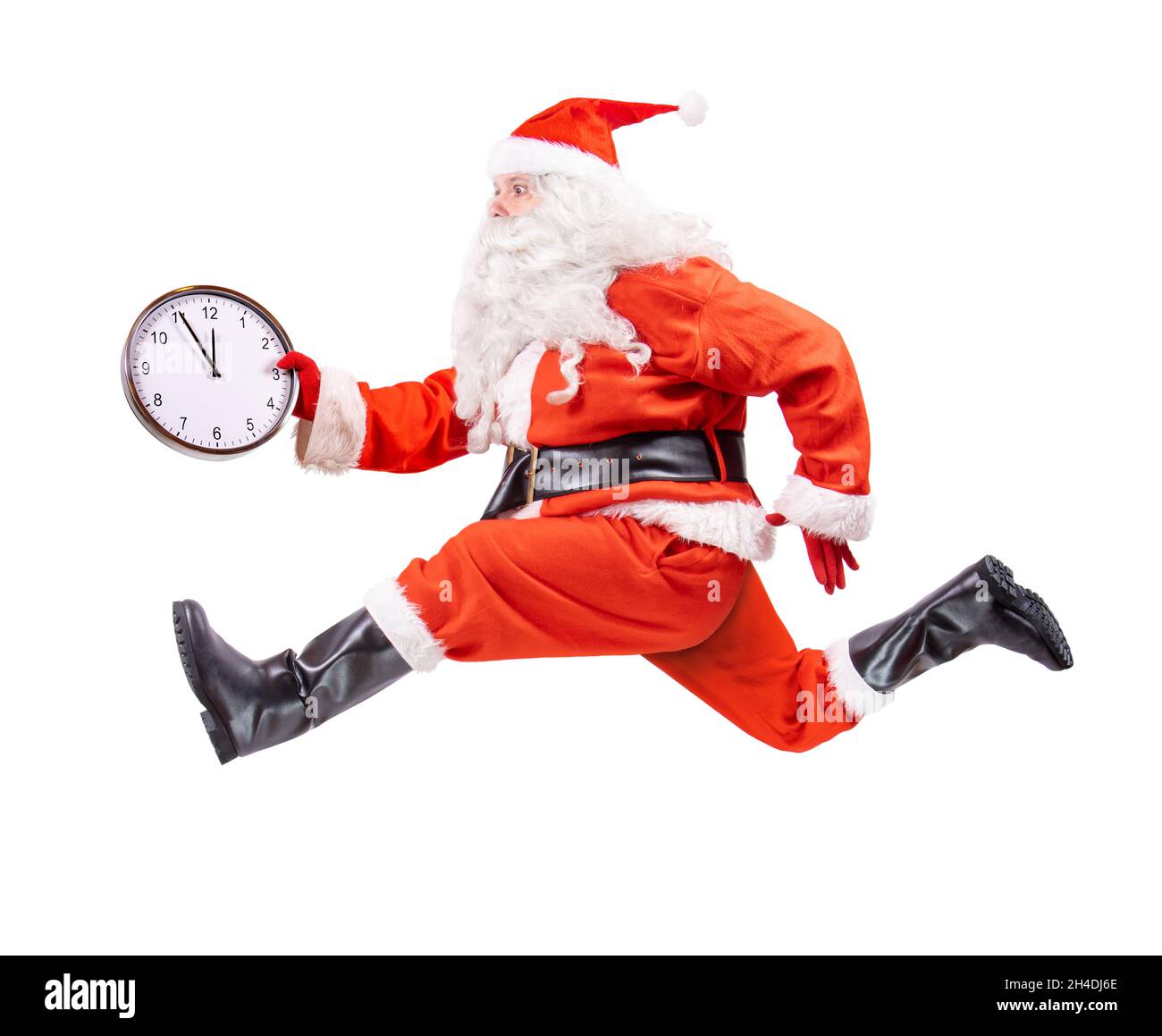 Santa Claus runs with the clock shows in five minutes twelve, isolated ...