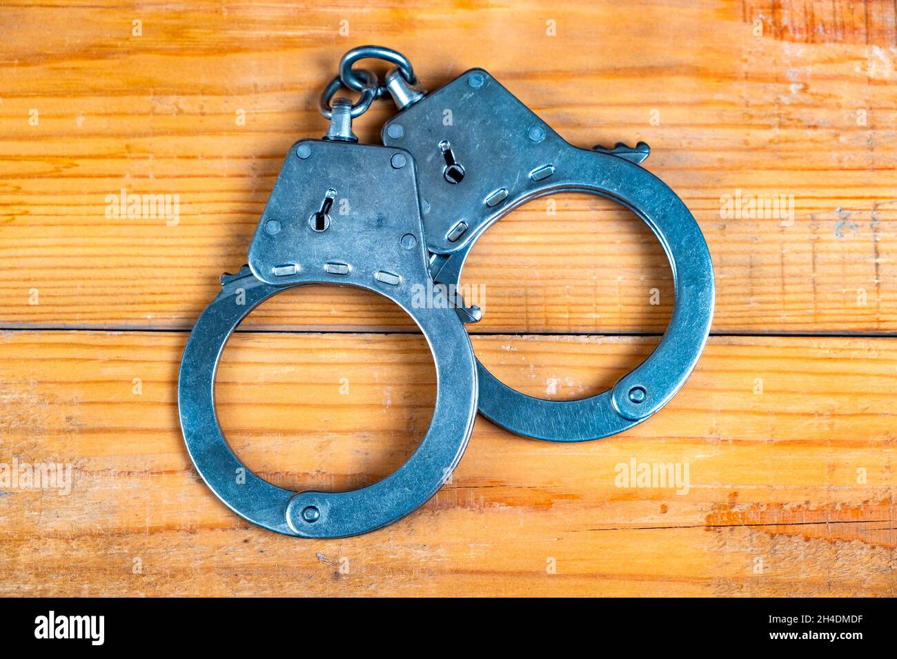 Old steel handcuffs hi-res stock photography and images - Alamy