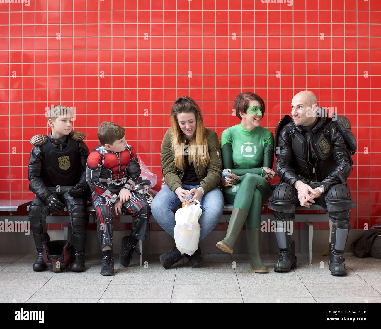A family dressed as cosplayers characters at the MCM London Comic Con ...