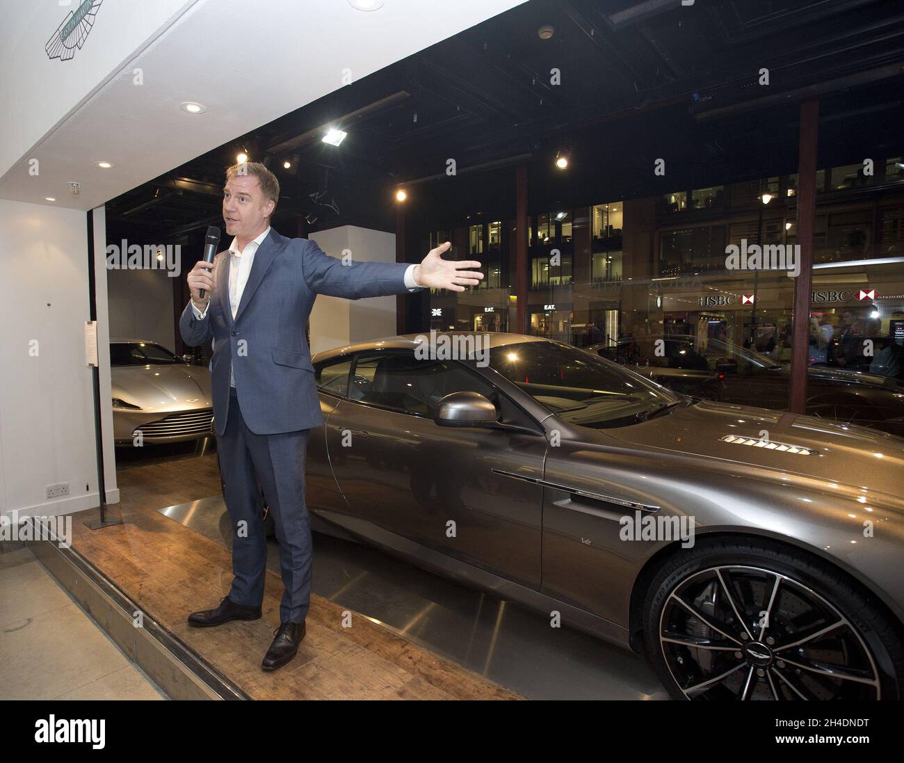Aston Martin Mark Reichman, chief creative officer, gives a speech at ...