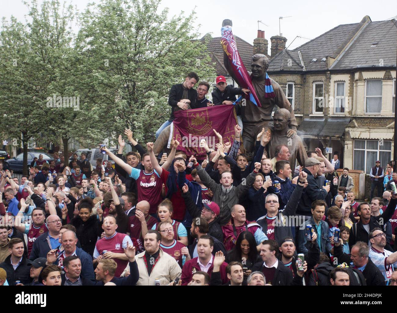 West Ham United fans chant from The Bobby Moore statue in Barking Road ...
