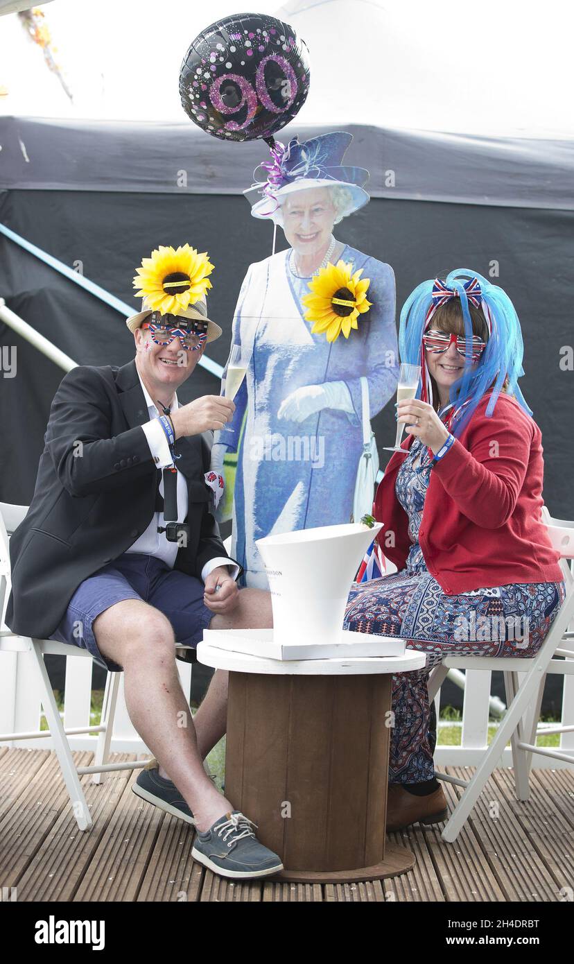 A festival-goer wears Union Jack glasses and wig while celebrating the ...