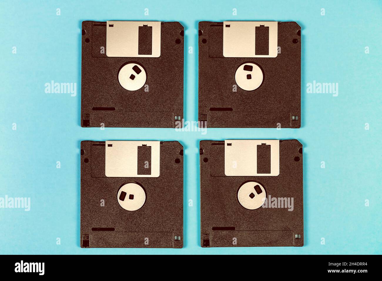 Toned Photo of Floppy Disks Drive Set on the Paper Background closeup ...