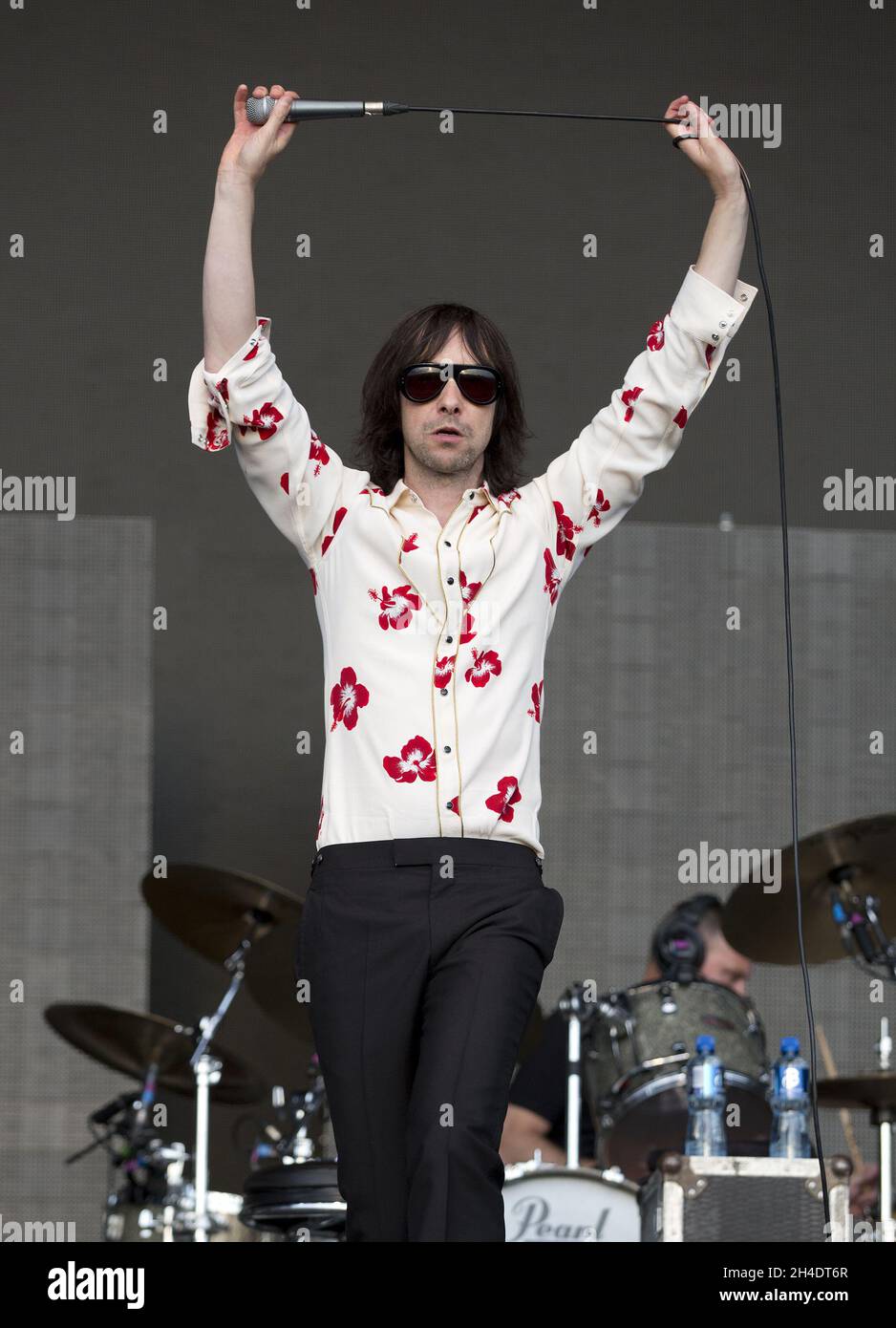 Primal Scream lead singer Bobby Gillespie plays on the Main Stage at ...