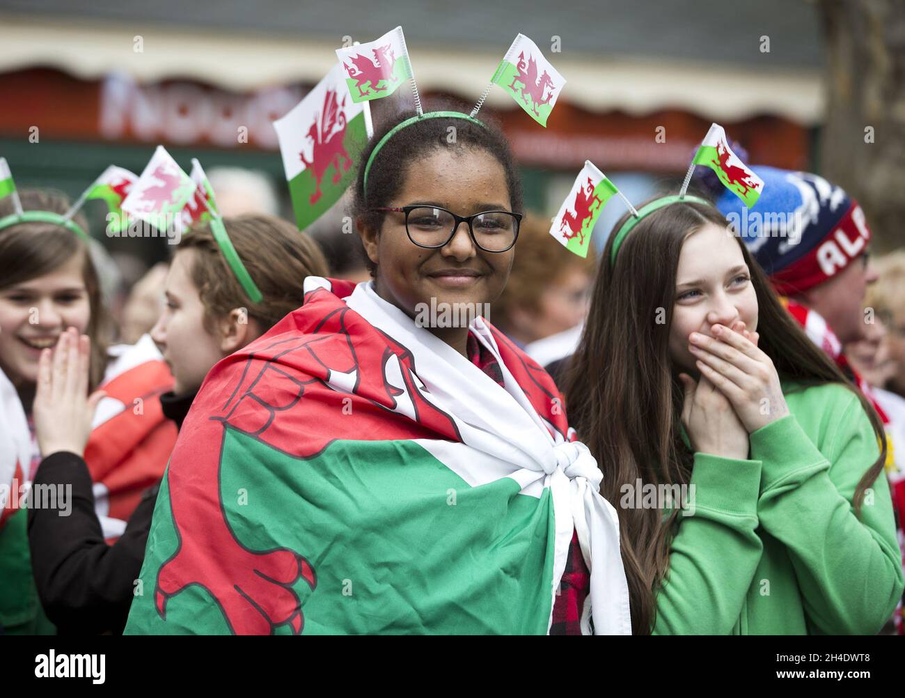 Young girls wear Welsh flags during the national St David's Day Parade ...
