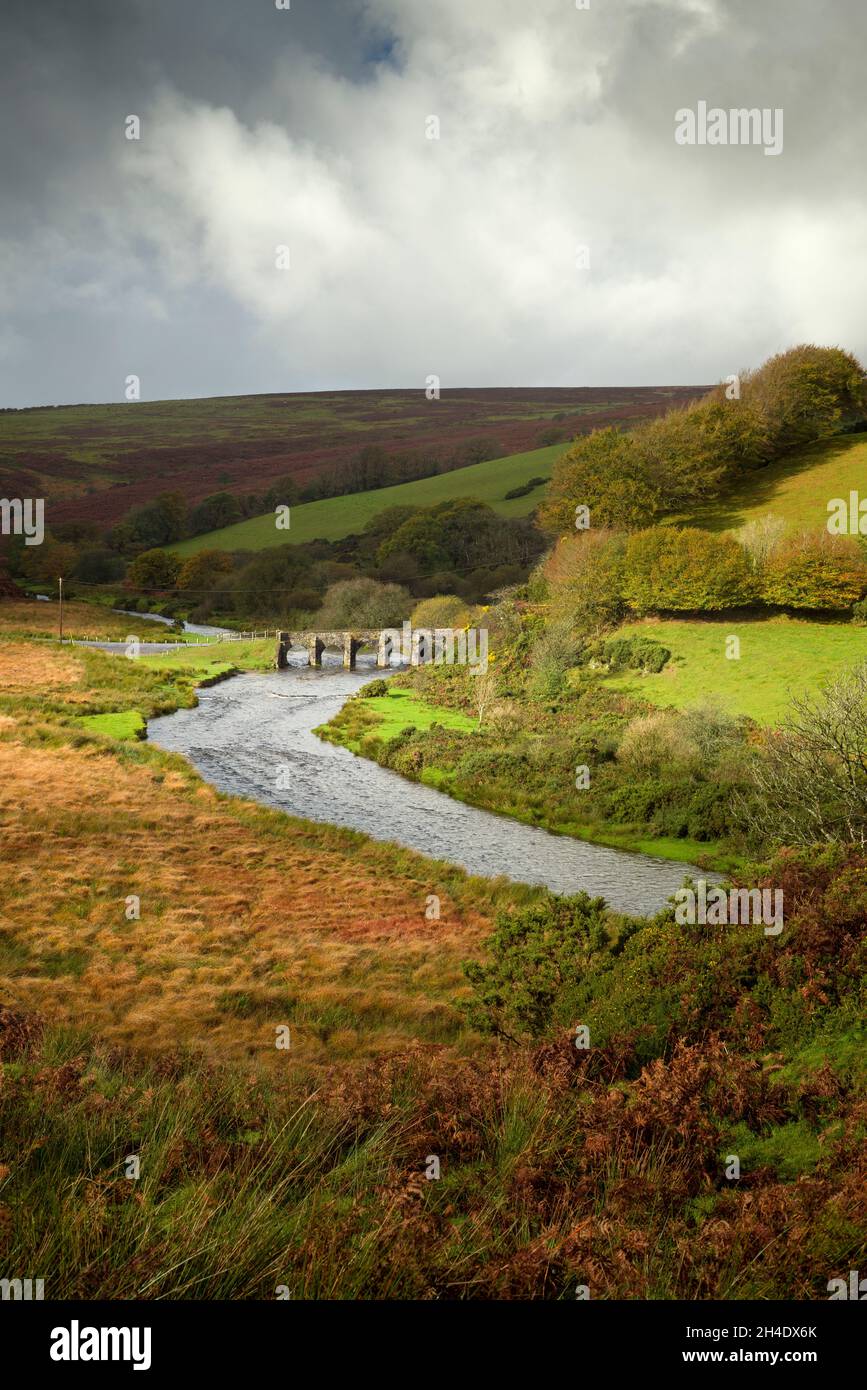 The medieval Landacre Bridge spanning the River Barle in autumn near ...