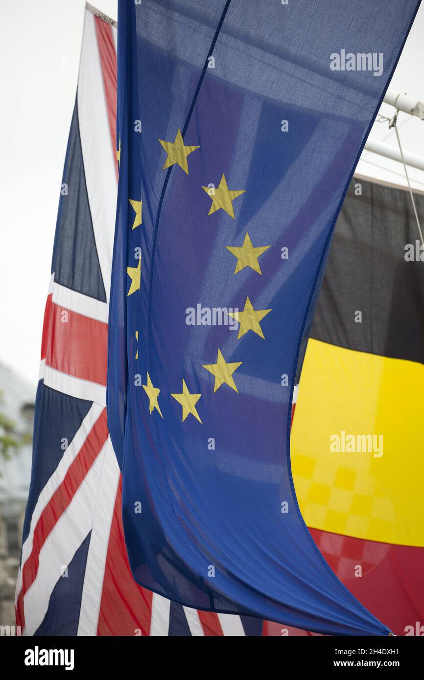 The Union Jack, German and European flag fly in front of the Big Ben ...