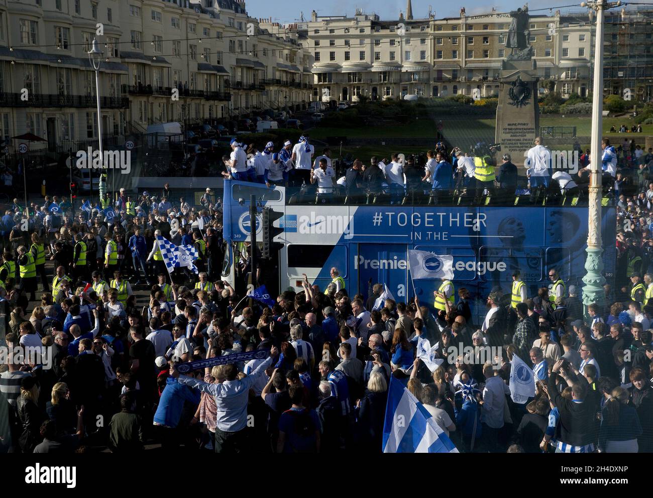 Brighton and Hove Albion football team goes in a seafront open-top bus ...