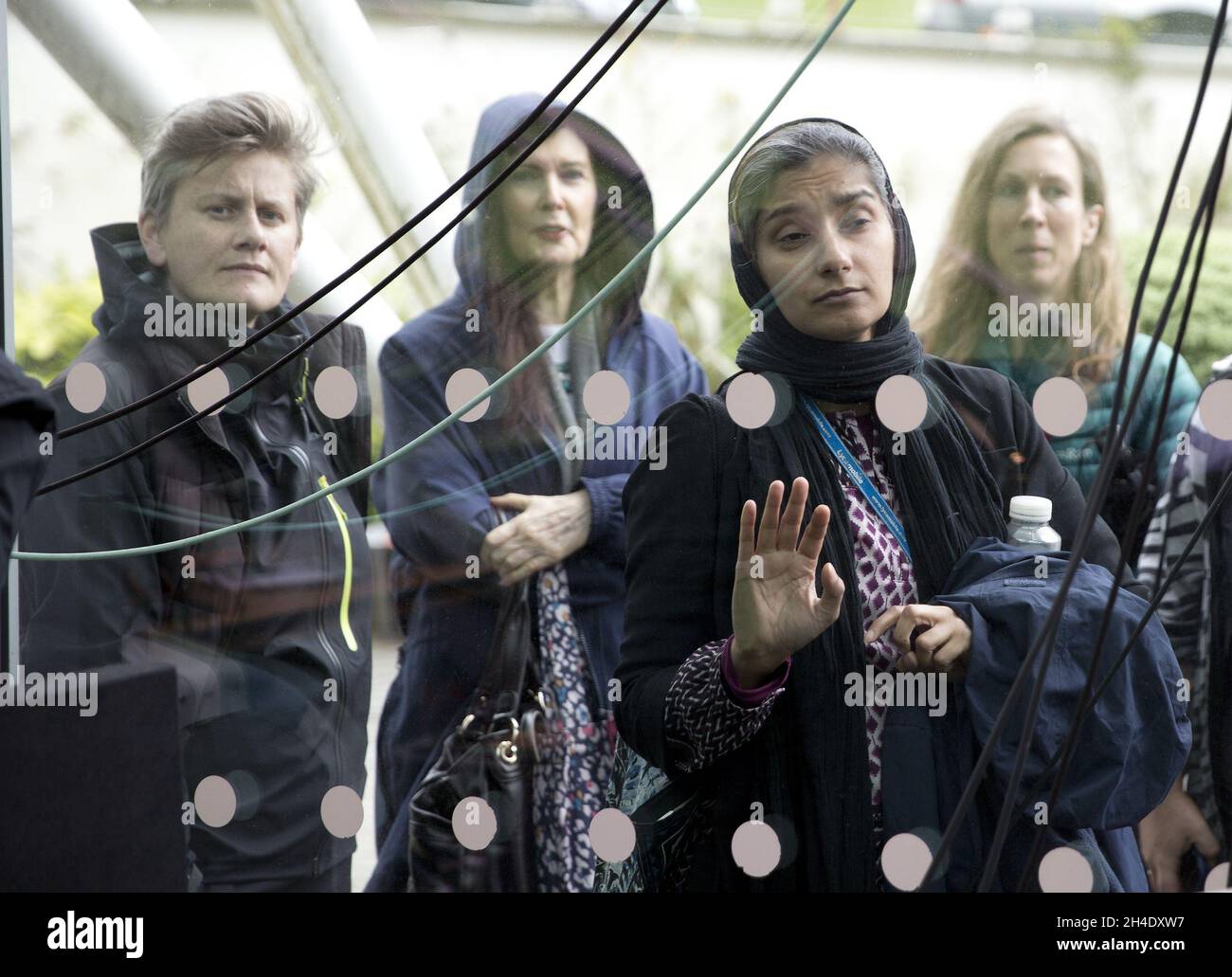 People peer through a window to see the Leader of the Labour Party ...