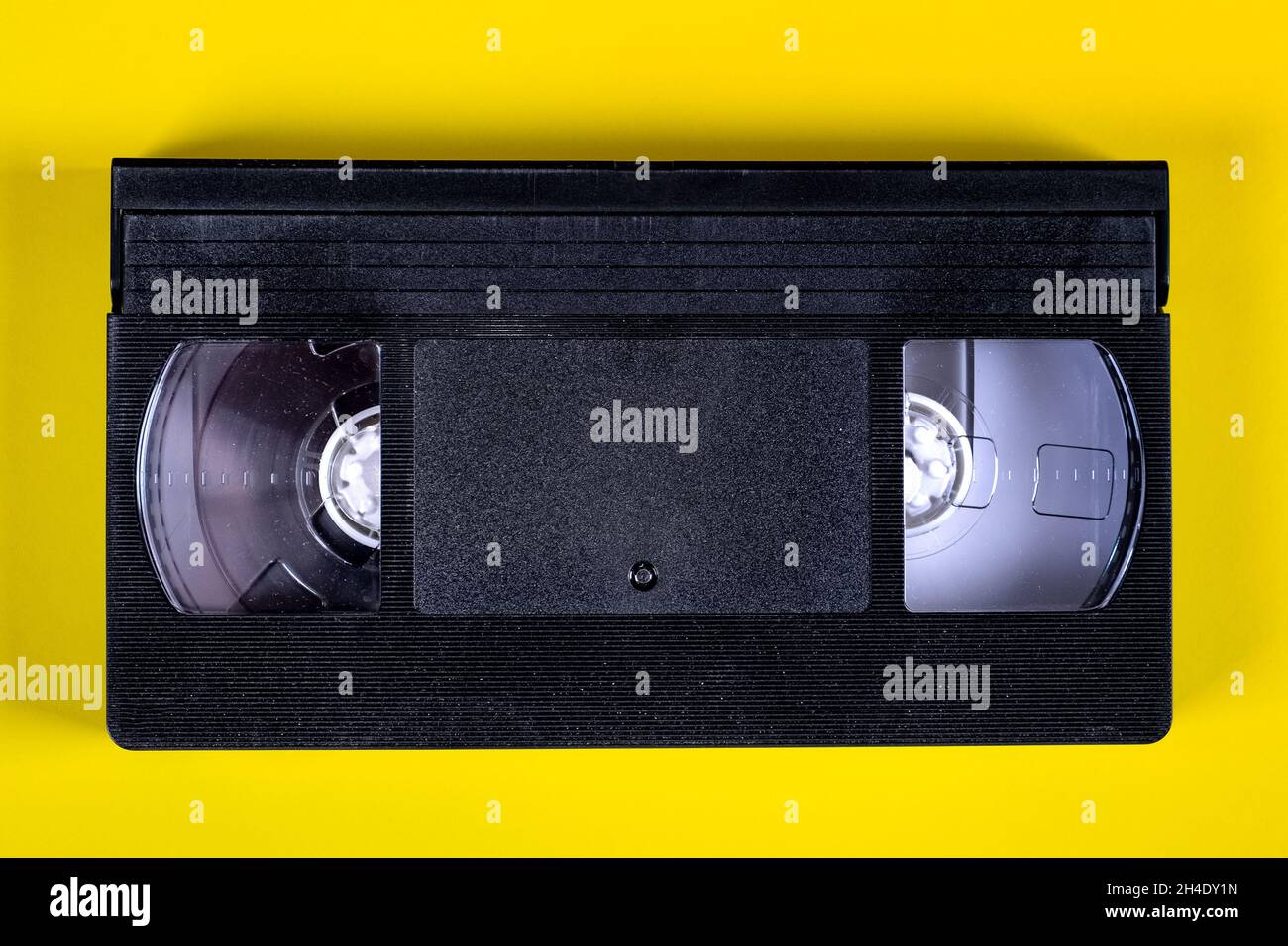 Retro Video Tape Cassette on a Yellow Paper Background Stock Photo - Alamy