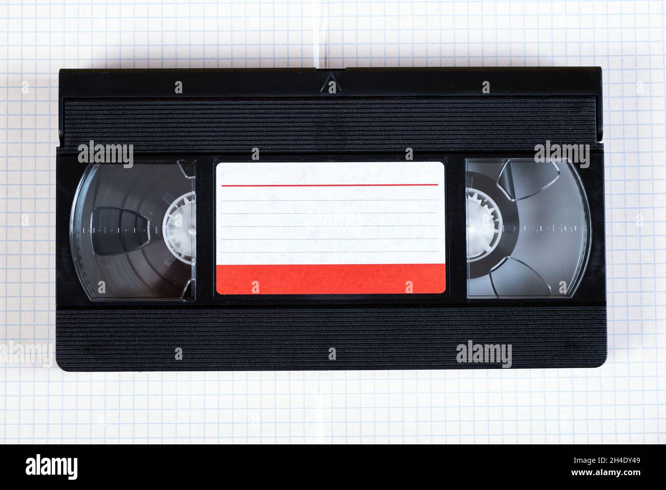 Retro Video Tape Cassette on the Square Paper Background closeup Stock ...