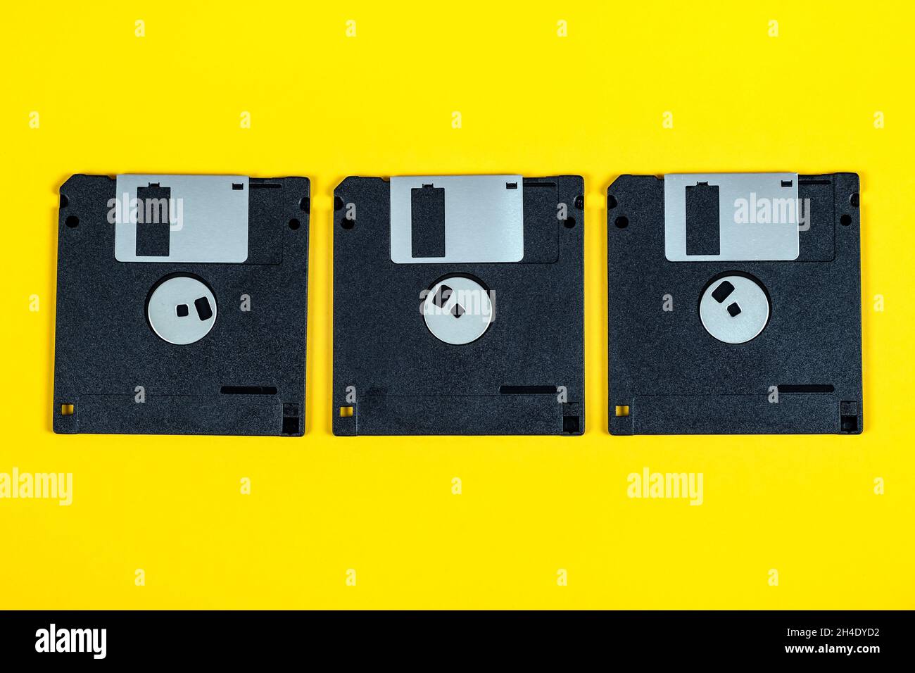 Floppy Disks Drive Set on the Yellow Paper Background closeup Stock ...