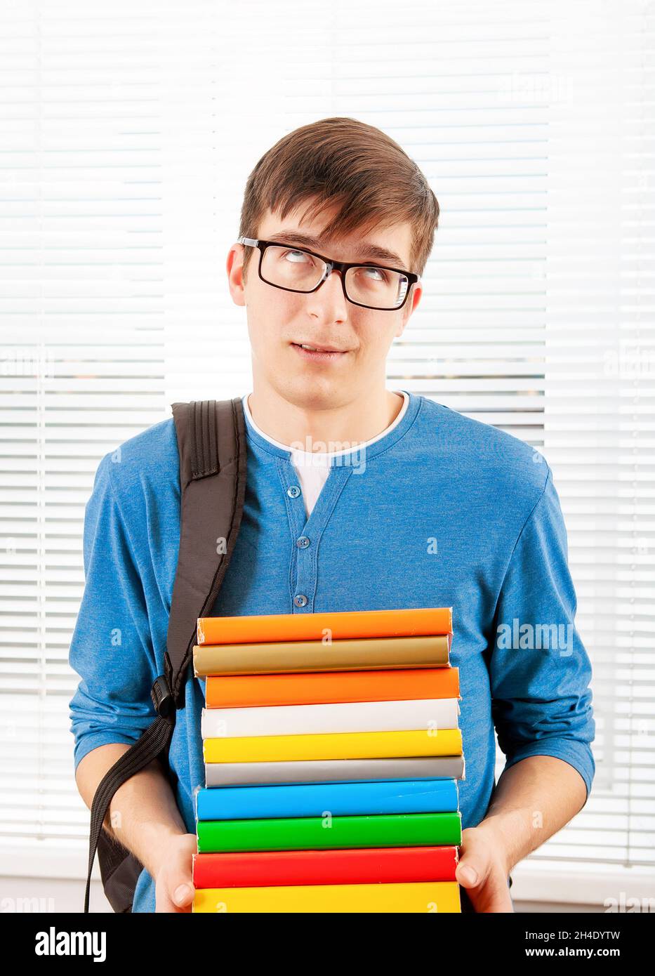 Unhappy bored male student hi-res stock photography and images - Alamy