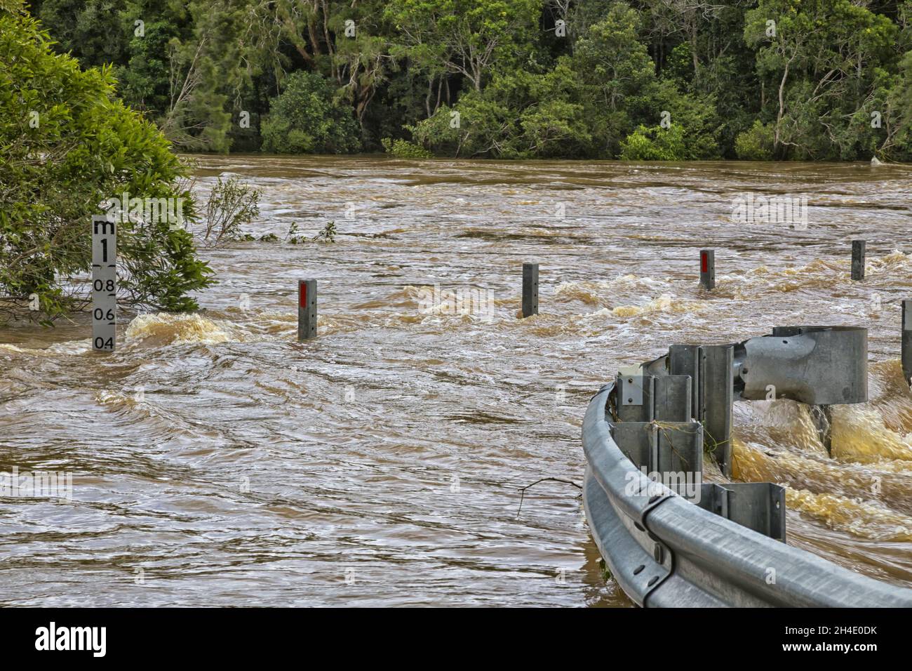 Flood Marker on a flooded road Stock Photo - Alamy