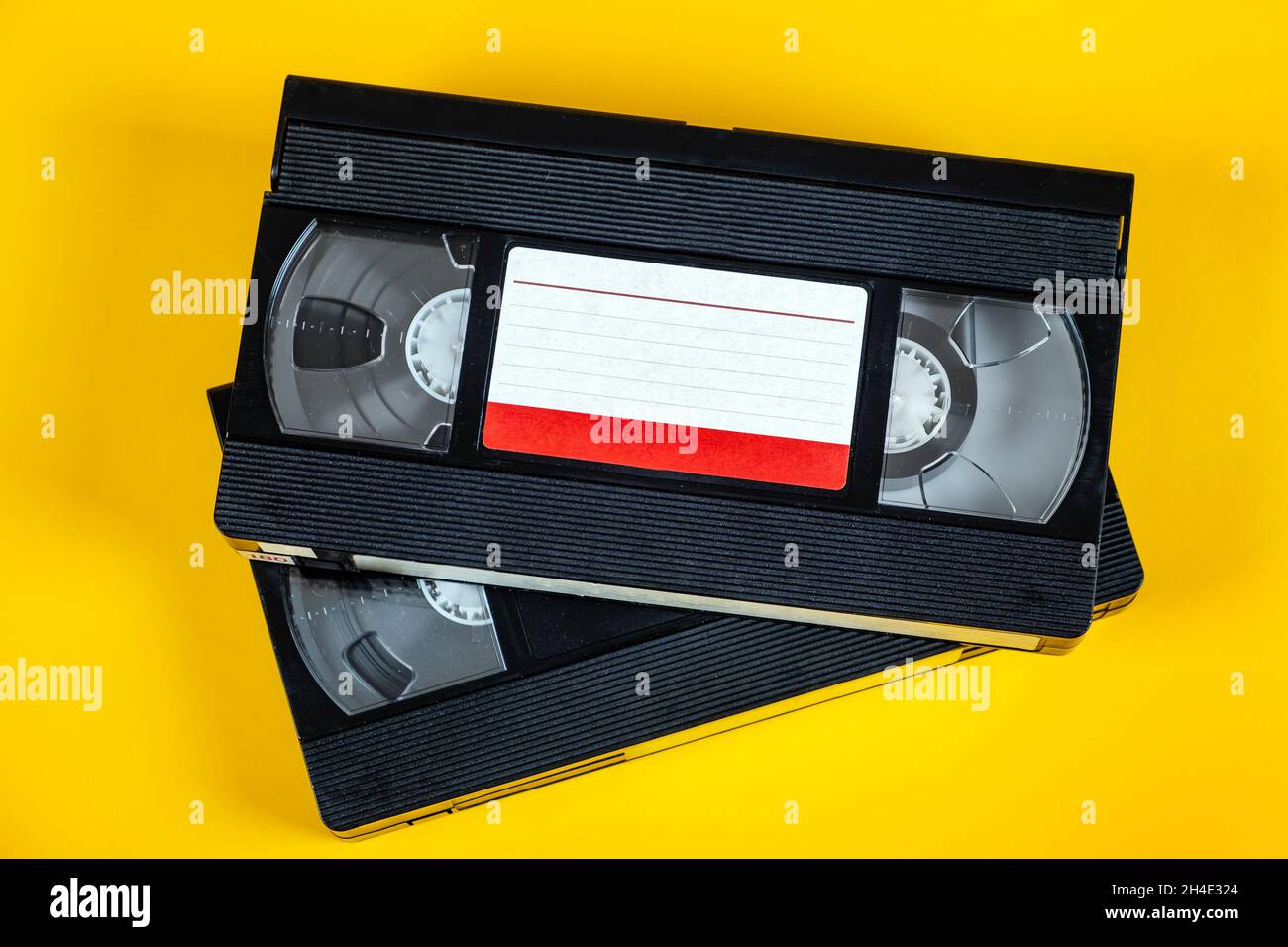 Two Retro Video Tape Cassette on a Yellow Paper Background Stock Photo ...
