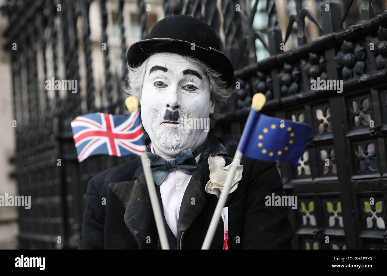 A Charlie Chaplin mime artist outside the Houses of Parliament in ...