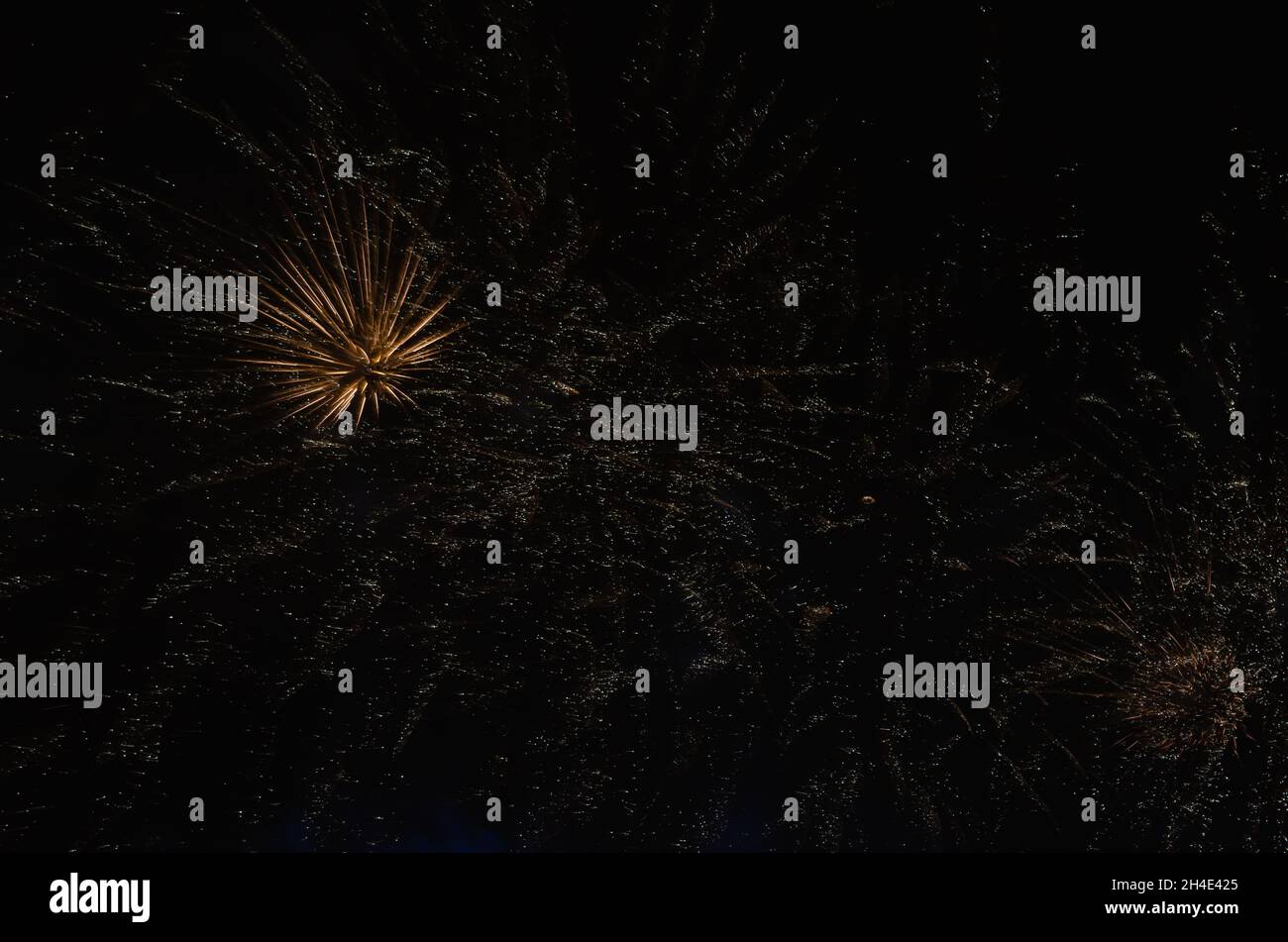 Dark night sky with fireworks in yellow colors Stock Photo - Alamy