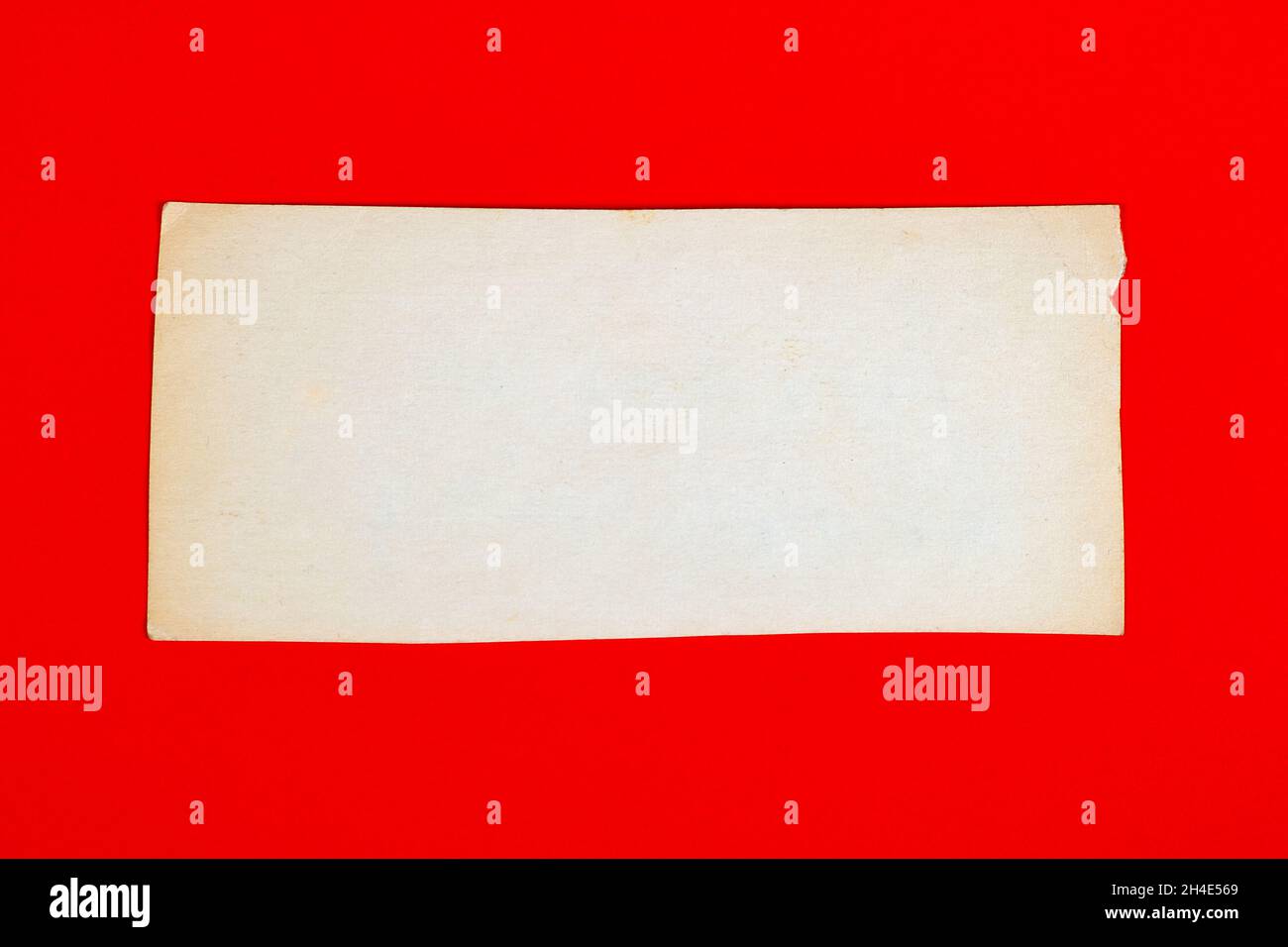 Old Empty Paper on the Red Colour Background Stock Photo - Alamy