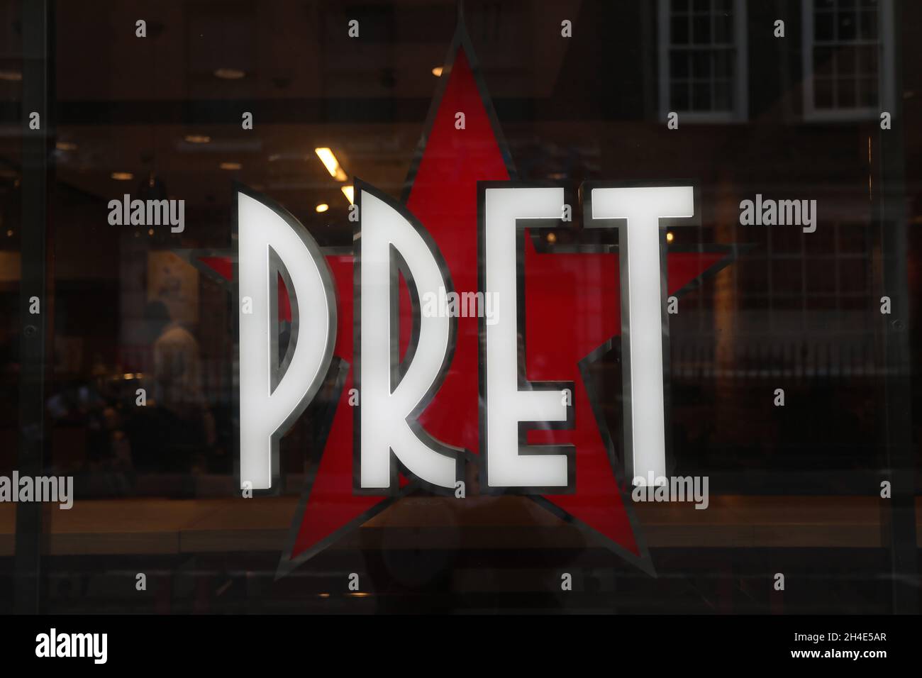 A sign with the Pret A Manger logo on a branch near Soho London ...