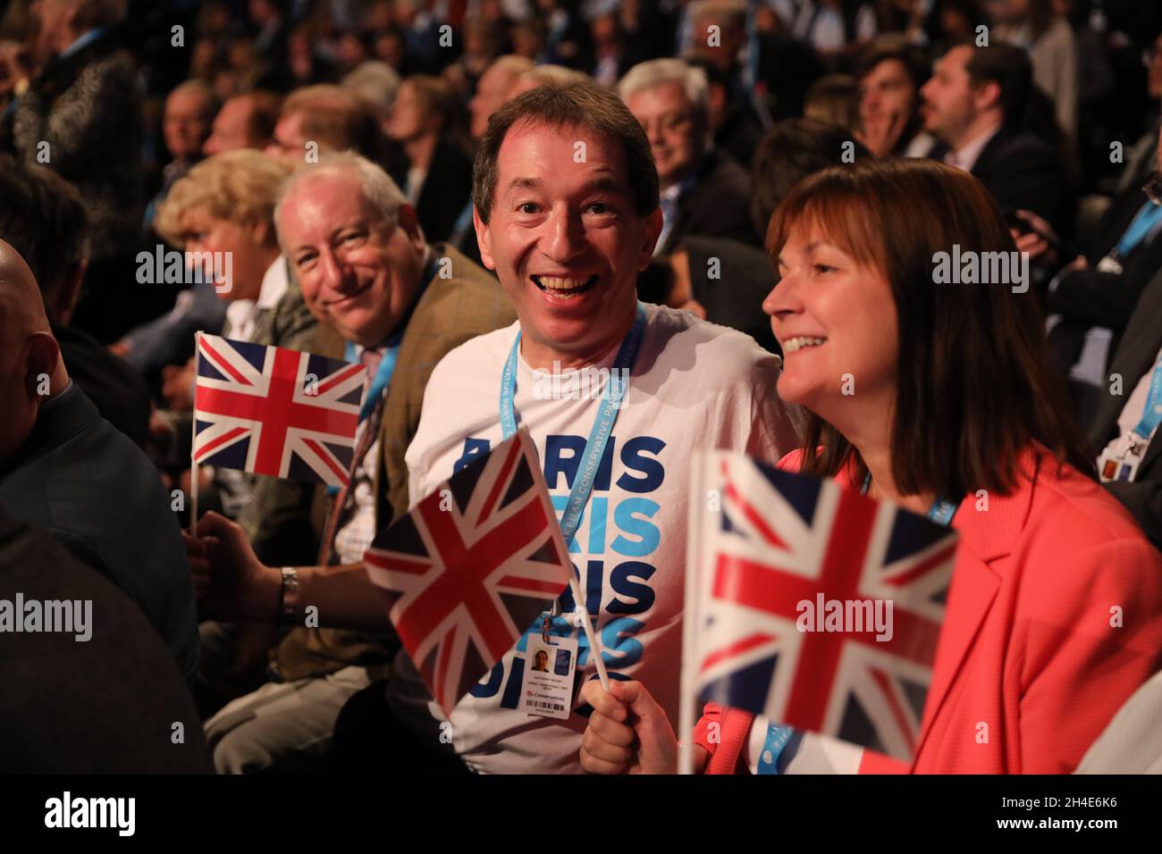 Delegates cheer with Union Jack flags to Prime Minister Boris Johnson's ...