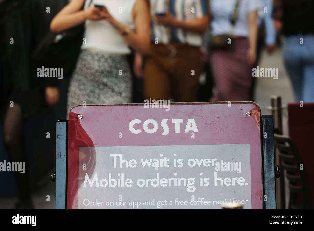 A shop sign for Costa Coffee advertising mobile ordering in London ...